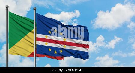 Congo and Cape Verde flag waving in the wind against white cloudy blue ...