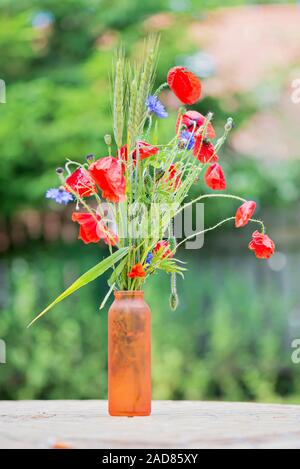 Bunch of wheat rye ears on wood board copy space food and drink concept ...
