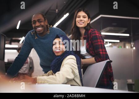 young multiethnics business team of software developers working ...