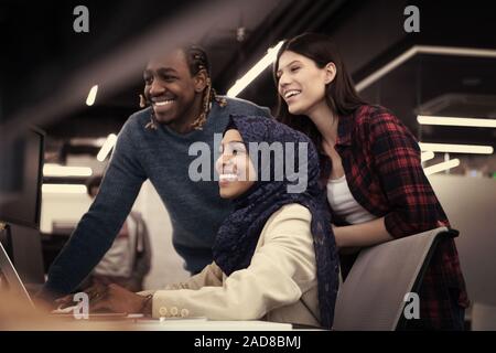 young multiethnics business team of software developers working ...