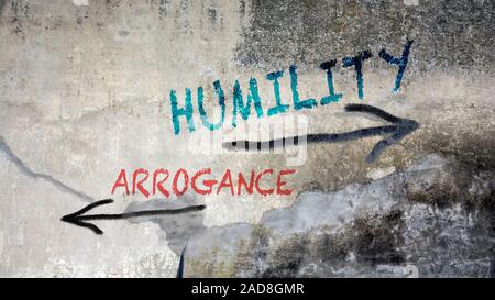 Street Graffiti Humility versus Arrogance Stock Photo - Alamy