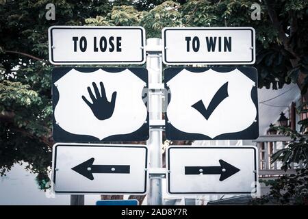 Street Sign TO WIN versus TO LOSE Stock Photo - Alamy