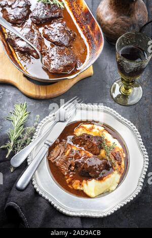 a Steak and Mashed Potatoes meal in a blue plate Stock Photo - Alamy