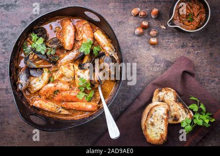 Traditional Catalan fish stew romesco de peix with prawns Stock Photo ...