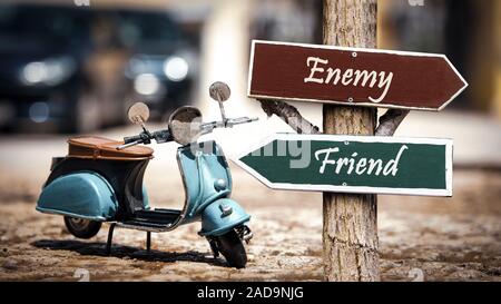 Street Sign to Friend versus Enemy Stock Photo - Alamy