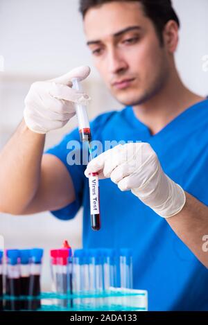 The young lab assistant testing blood samples in hospital Stock Photo ...