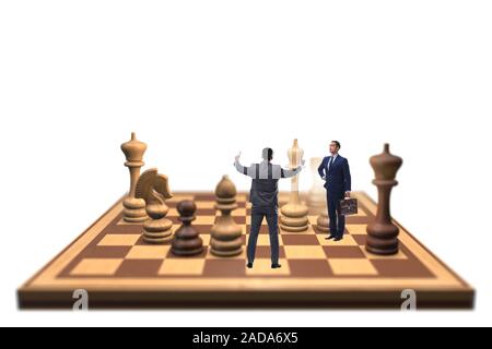 The businessman in large chess board in strategy concept Stock Photo ...