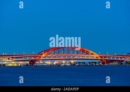 Sunset twilight monorail track and highway red bridge to Kobe downtown ...