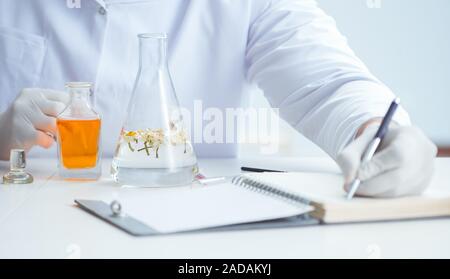 Chemist mixing perfumes in the lab Stock Photo - Alamy