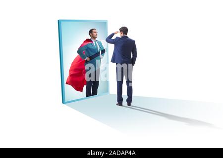 The businessman seeing himself in mirror as superhero Stock Photo - Alamy
