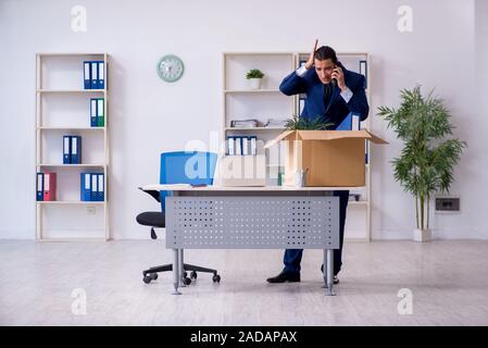 The young employee being made redundant Stock Photo - Alamy