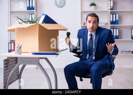 The young employee being made redundant Stock Photo - Alamy