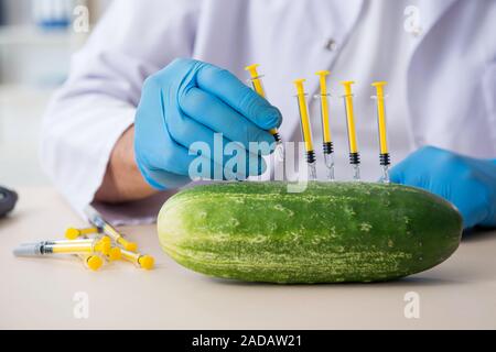The male nutrition expert testing vegetables in lab Stock Photo - Alamy