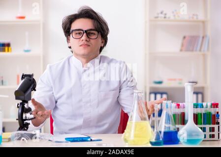 Young male biochemist working in the lab Stock Photo - Alamy