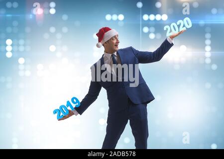 Businessman looking into the future 2020 from 2019 Stock Photo - Alamy