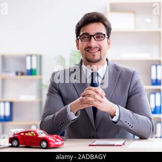 Agent offering car motor insurance Stock Photo - Alamy