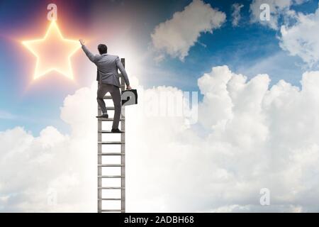 The businessman reaching out for stars Stock Photo - Alamy