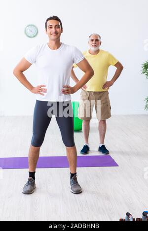 The old man doing exercises indoors Stock Photo - Alamy