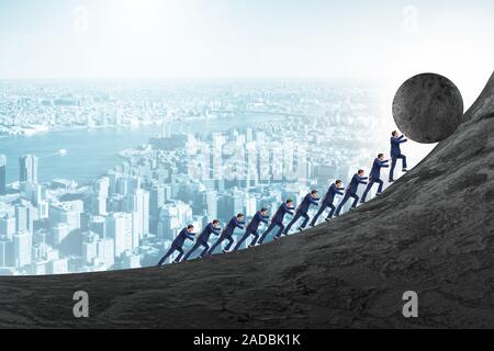The team of people pushing stone uphill Stock Photo - Alamy