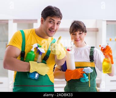 Cleaning professional contractors working at house Stock Photo - Alamy