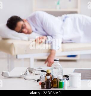 The doctor relaxing after complex surgery in hospital Stock Photo - Alamy