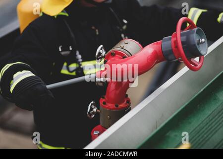 Hands with fire extinguisher Stock Photo - Alamy