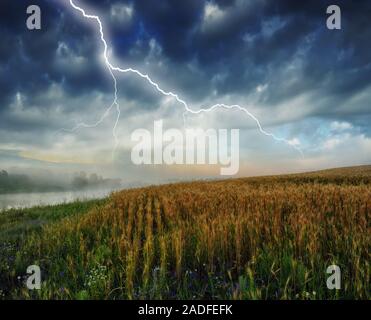 Thunderstorm with lightning over the hilly landscape Stock Photo - Alamy