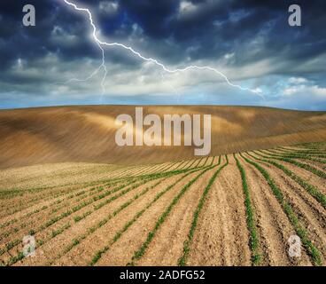 Thunderstorm with lightning over the hilly landscape Stock Photo - Alamy