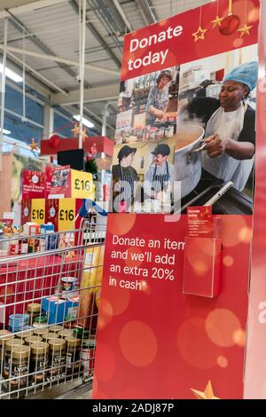 Sign, display stand and donation leaflets at the Tesco supermarket ...
