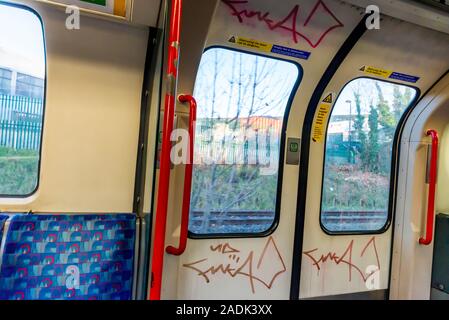Graffiti inside a London Underground tube train carriage. Subway ...