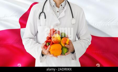Doctor holding stethoscope with Greenland flag. Greenland Health and ...