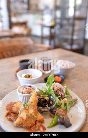 Side shot of the various food served on the white plate Stock Photo - Alamy