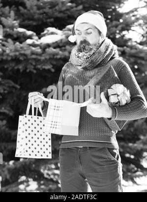 Surprised man in santa claus hat, bearded hipster with beard and ...