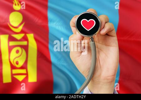 Doctor holding stethoscope with Mongolia flag. Mongolia health and care ...