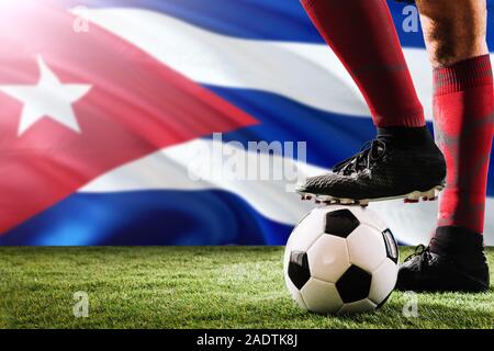 Cuba flag on ball at corner kick position, soccer field background ...