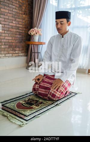 Man, praying and bow in islam religion at house of spiritual worship ...