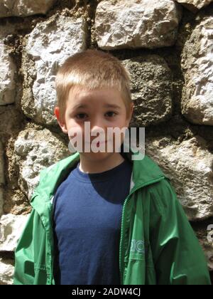 Boy portrait, stony background, funny face expression Stock Photo - Alamy
