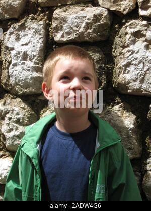 Boy portrait, stony background, funny face expression Stock Photo - Alamy