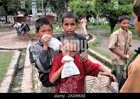 boys sniffing glue Stock Photo - Alamy