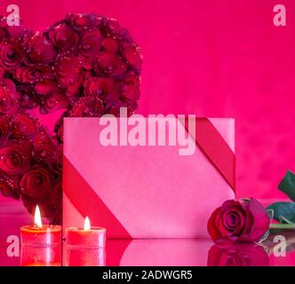 Rose with a gift card and candles. Romantic composition Stock Photo - Alamy