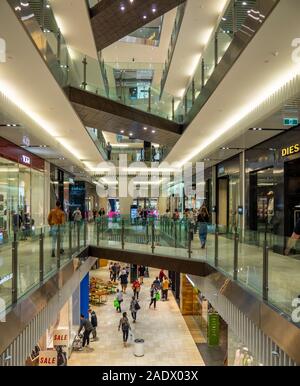 Underside of pedestrian bridges across multiple levels in atrium in ...