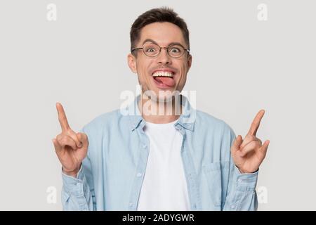 Crazy punk. Emotional young man, rock musician posing aggressively with ...
