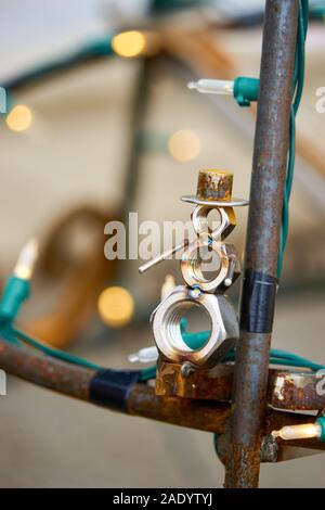Christmas tree of bolts and nuts on a golden background Stock Photo - Alamy