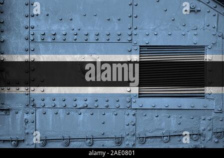 Botswana flag depicted on side part of military armored tank close up ...