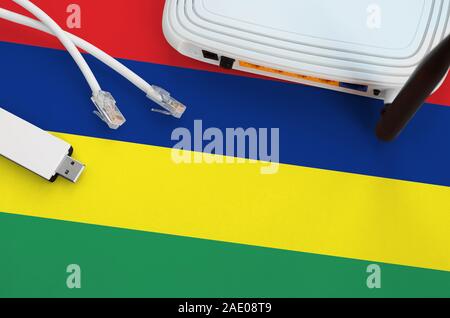 Mauritius flag depicted on table with internet rj45 cable, wireless usb ...