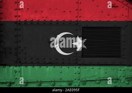 Libya flag depicted on side part of military armored helicopter close ...