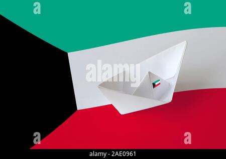 Kuwait flag depicted on paper origami ship closeup. Oriental handmade ...