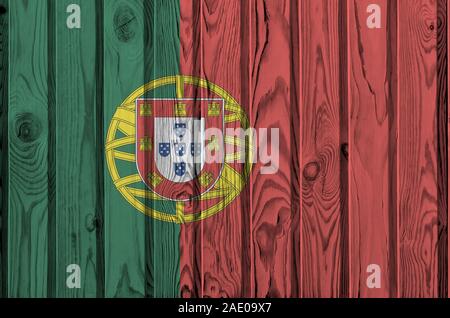 Portugal flag depicted in bright paint colors on old wooden wall close ...