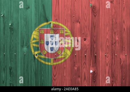 Portugal flag depicted in bright paint colors on old wooden wall close ...