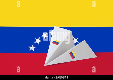Venezuela flag depicted on paper origami crane wing. Oriental handmade ...